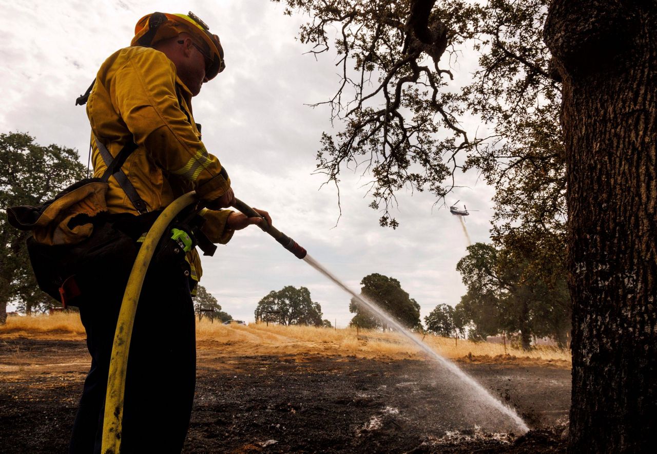 Wind-driven wildfire spreads outside a central Oregon community and ...