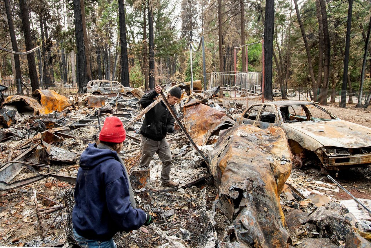 Residents head back into California town leveled by wildfire
