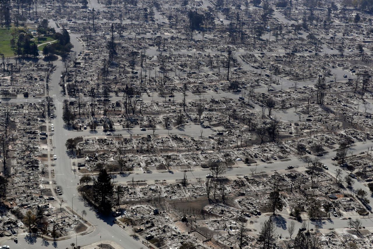 California wildfire victims say cleanup crews add to woes