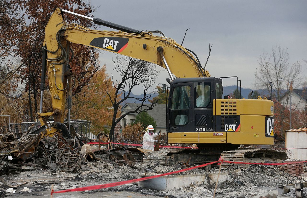 California wildfire victims say cleanup crews add to woes