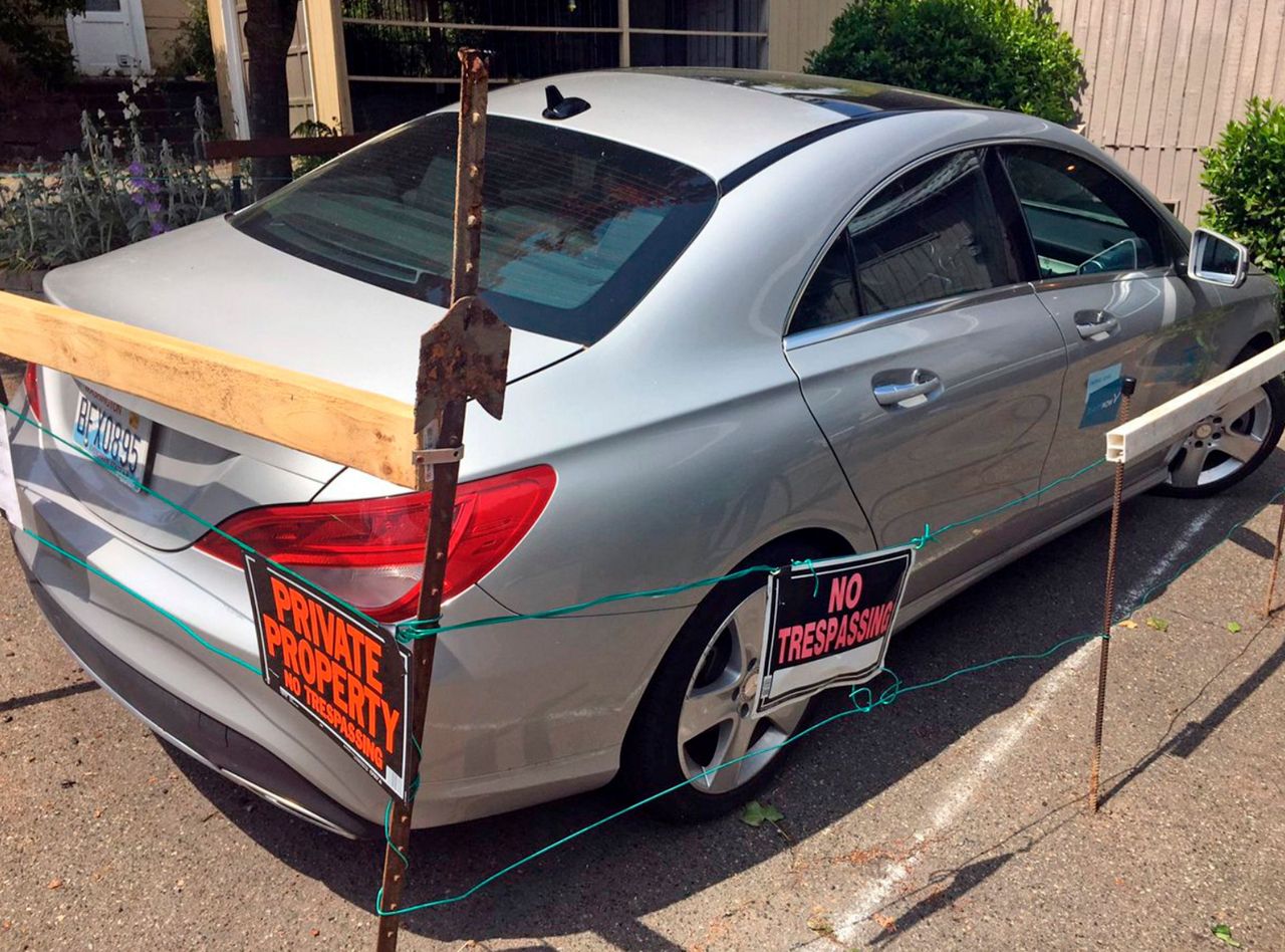 Seattle man builds fence around car-share vehicle at duplex