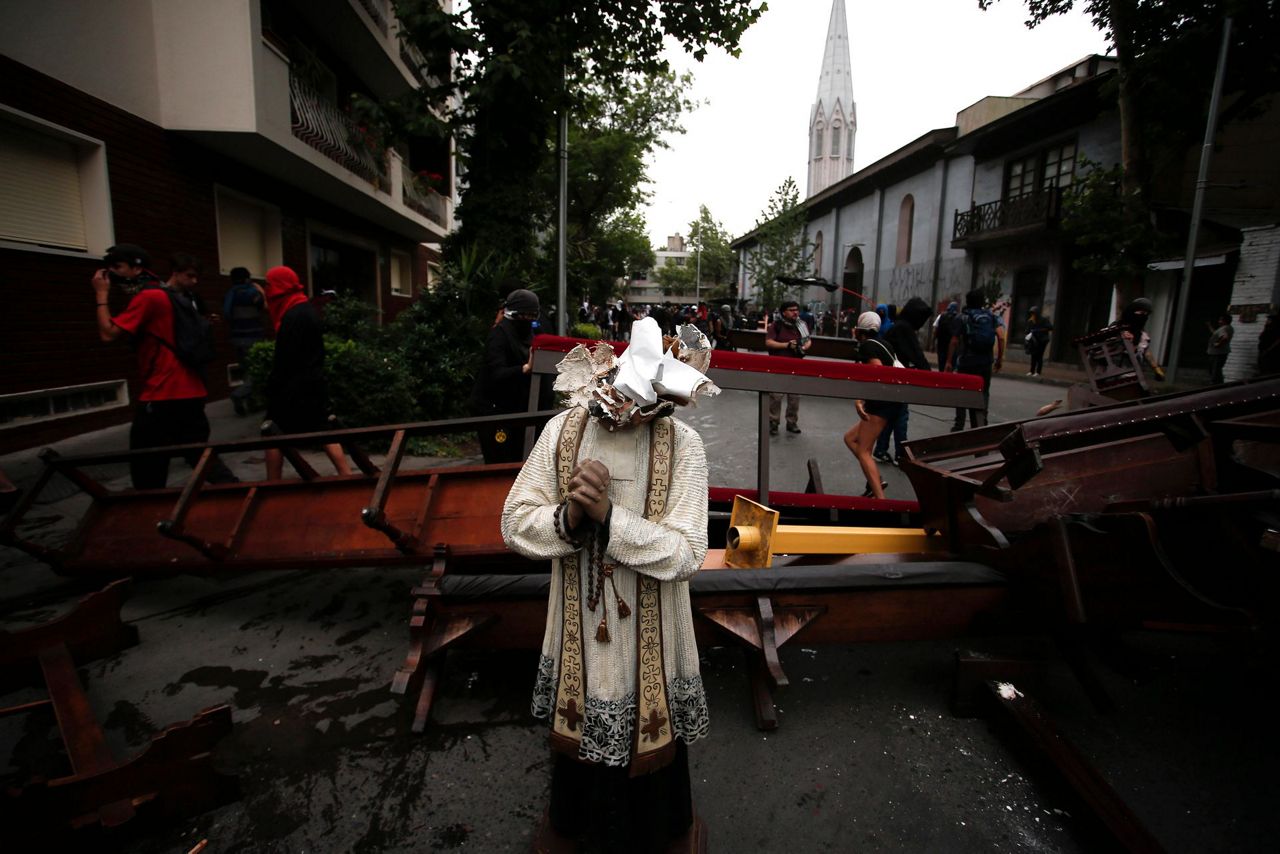 Chilean Catholic church looted by vandals as protests rage