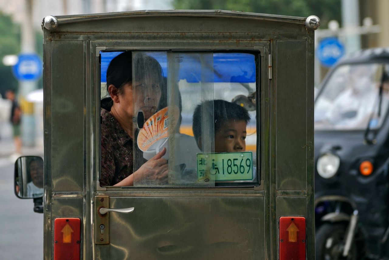 Heavy flooding displaces 10,000 in China as Beijing has respite from ...