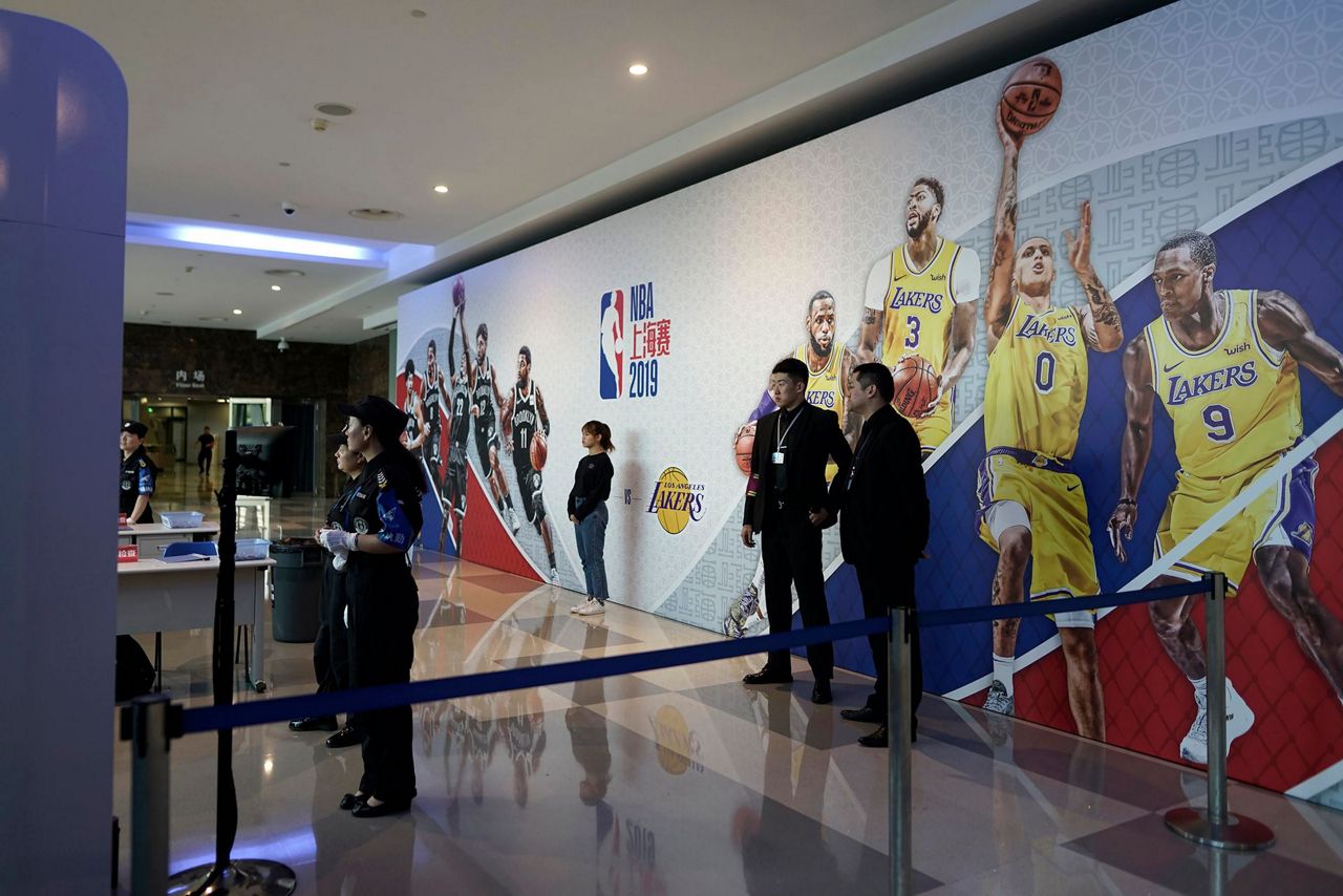 Irving aggravates injury, Nets hold off Lakers in Shanghai