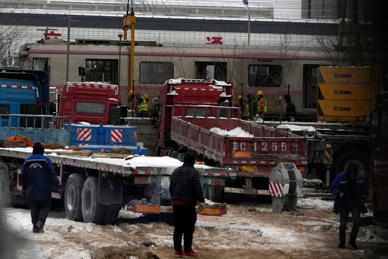 515 injured in a Beijing rail collision as heavy snow hits the Chinese ...