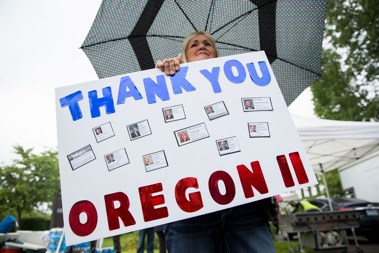 Truckers, loggers circle Oregon Capitol amid climate fight