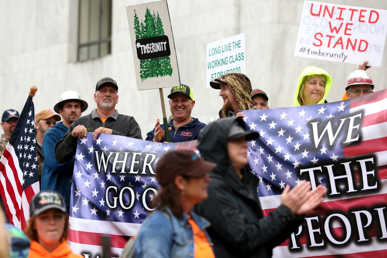 Truckers, loggers circle Oregon Capitol amid climate fight