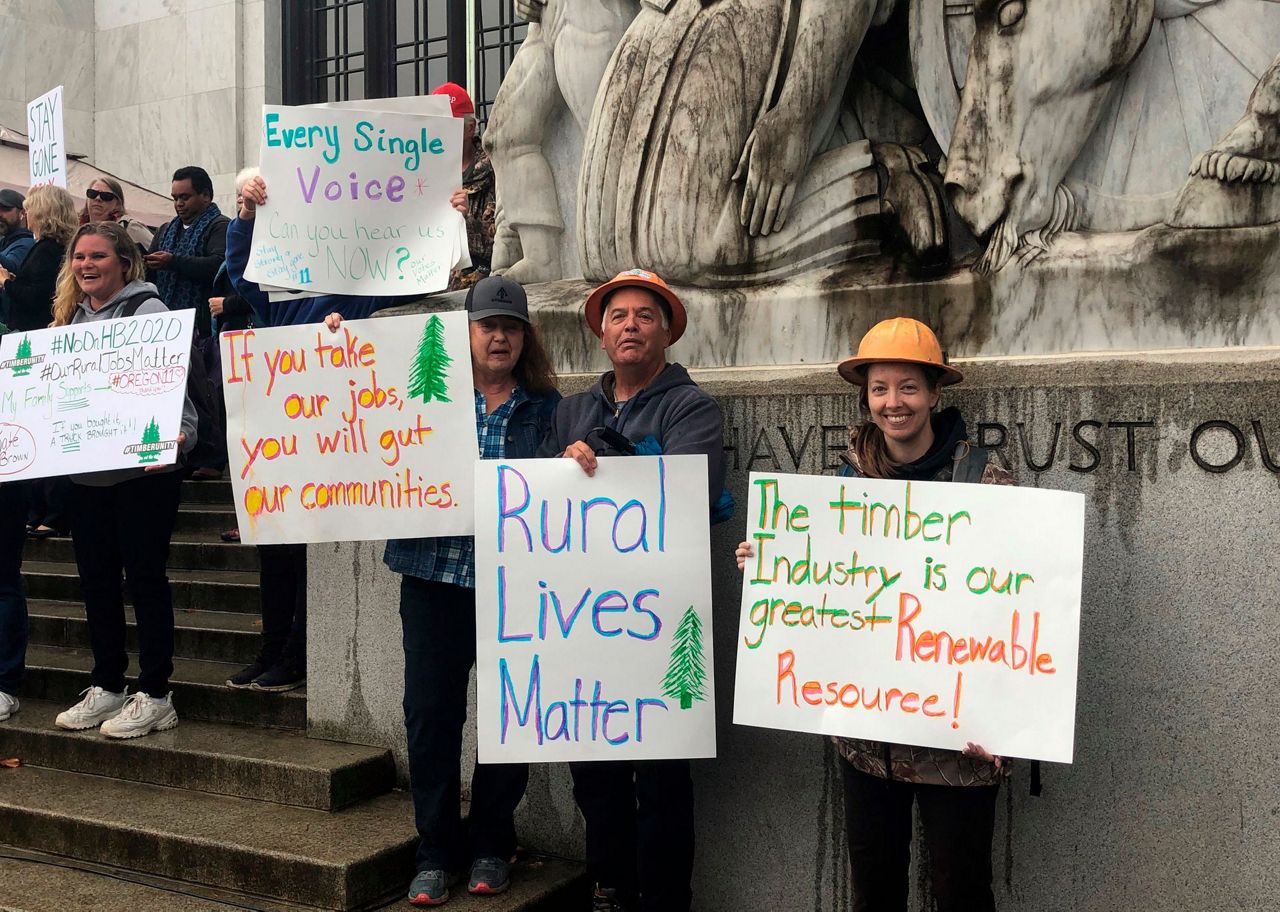 Truckers, loggers circle Oregon Capitol amid climate fight