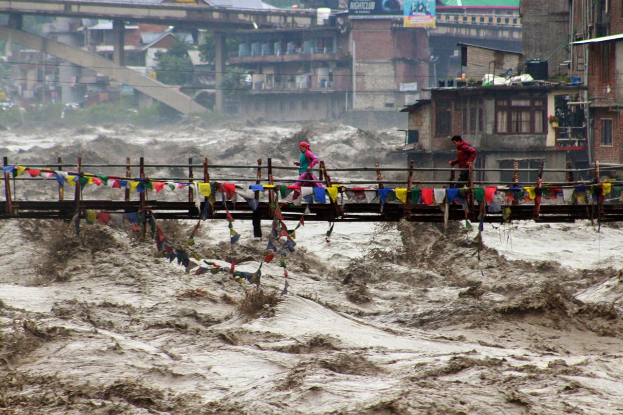 Powerful rain and floods devastate northern India as experts blame ...