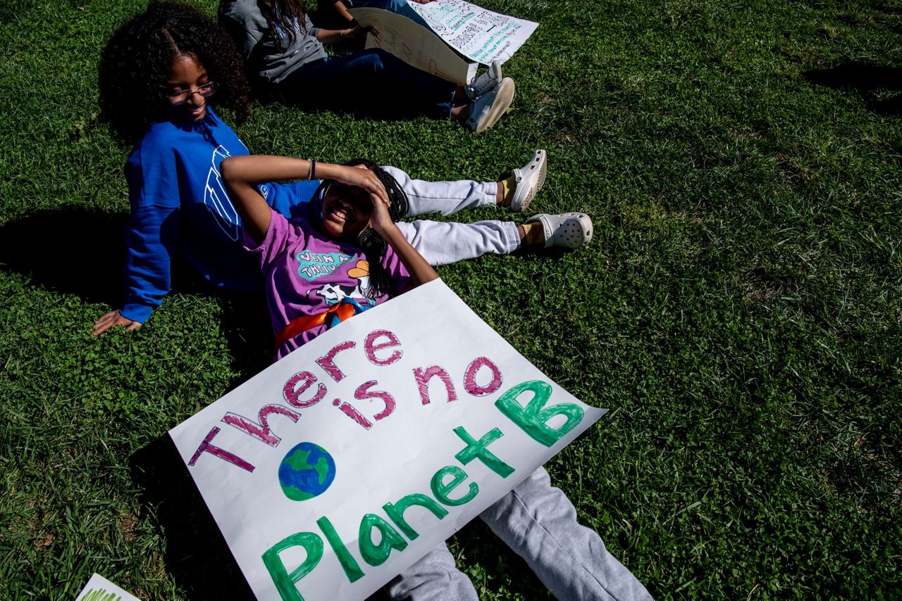 Protesters fear climate change impacts, demand aid for poor