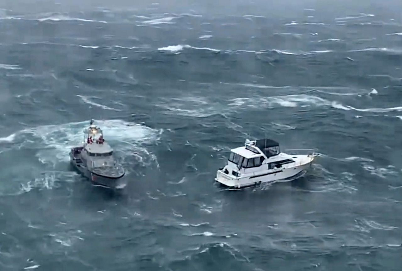 Coast Guard makes dramatic rescue as wave rolls yacht