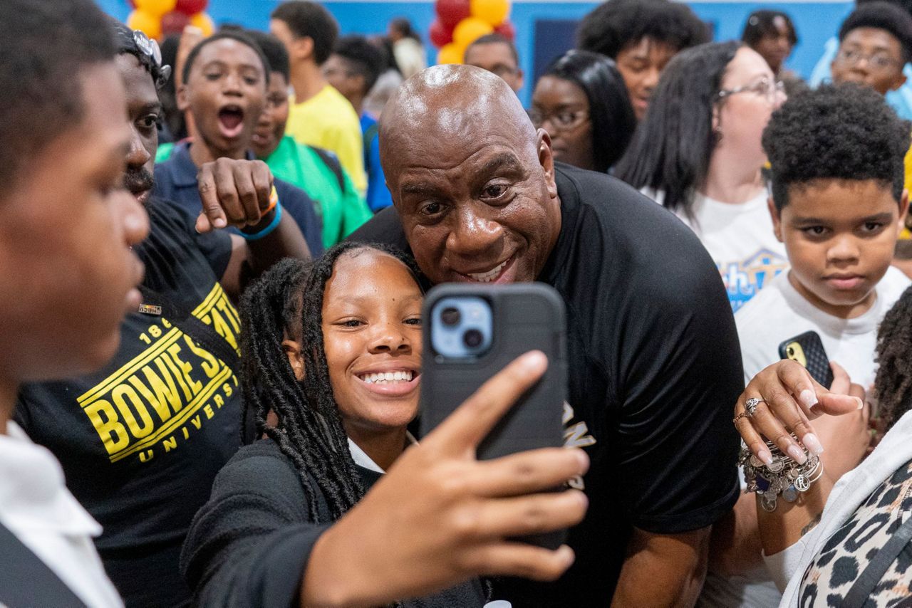 Magic Johnson, Josh Harris and other new Commanders owners introduce ...