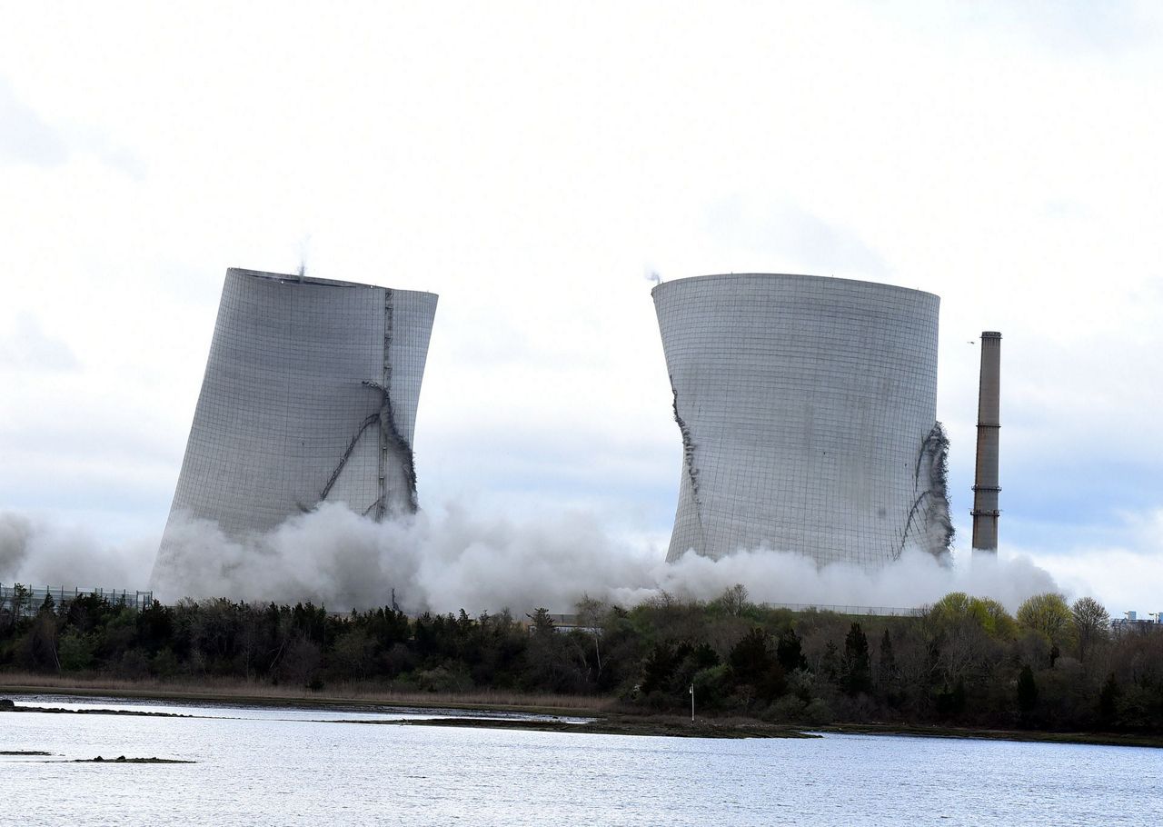 Poof, they're gone: Power plant towers demolished in seconds