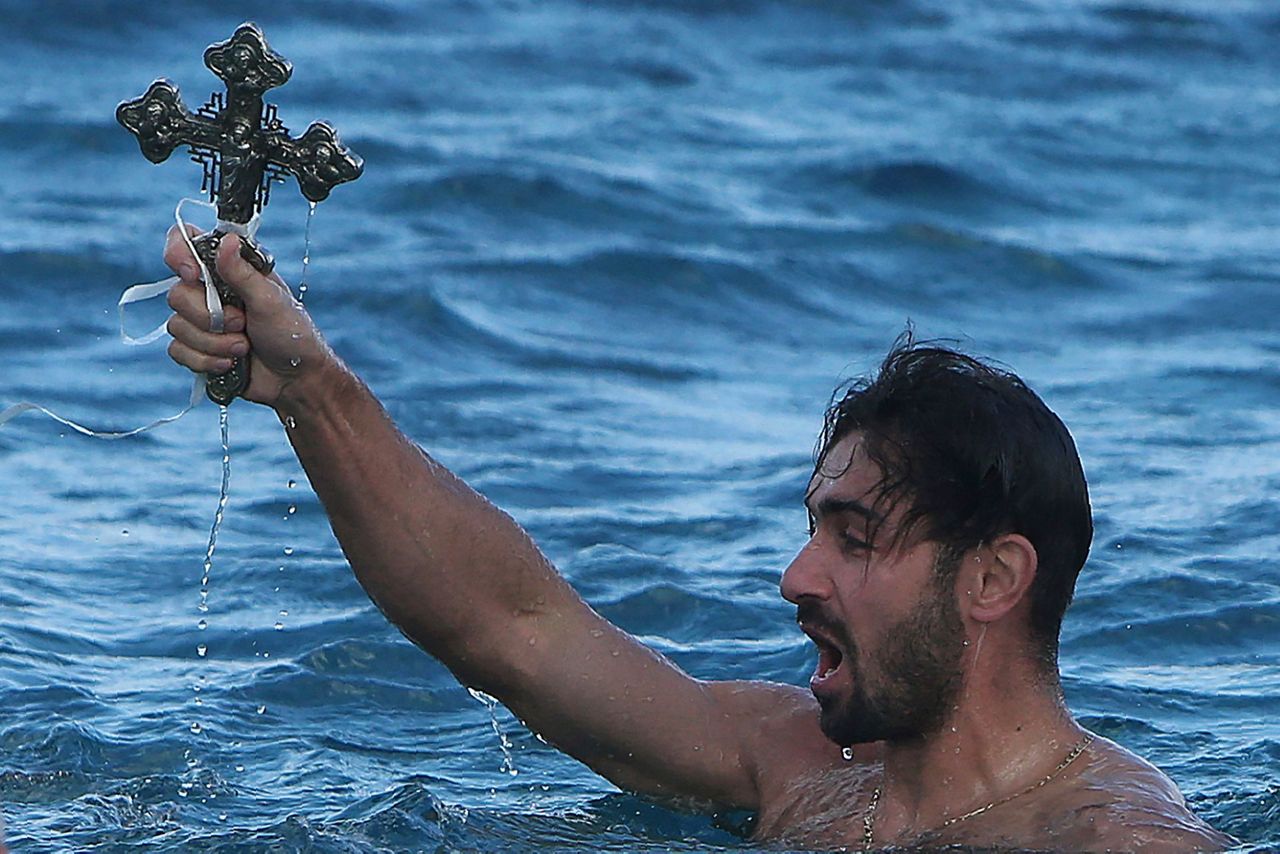 Seeking the cross: Icy dips mark the feast of Epiphany
