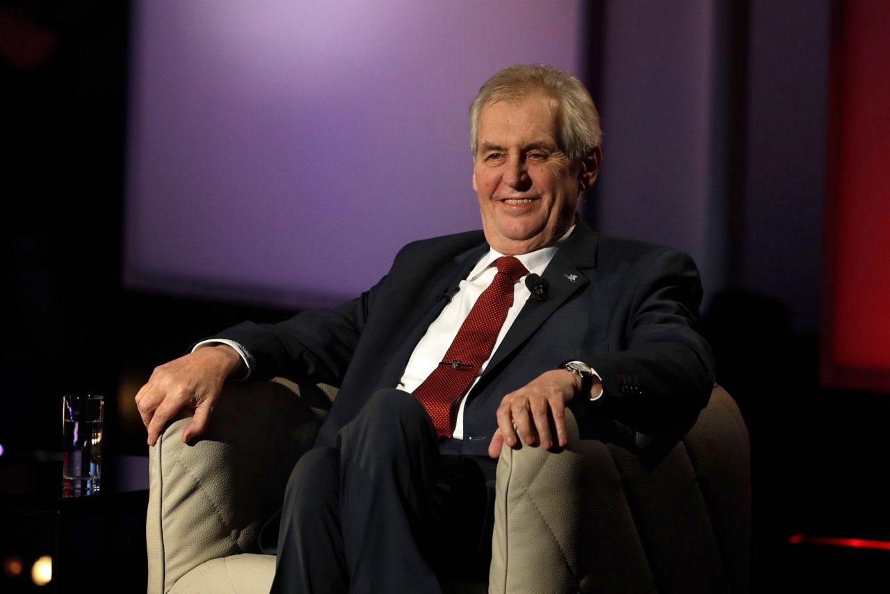 Czech President Milos Zeman leaves, opponents celebrate