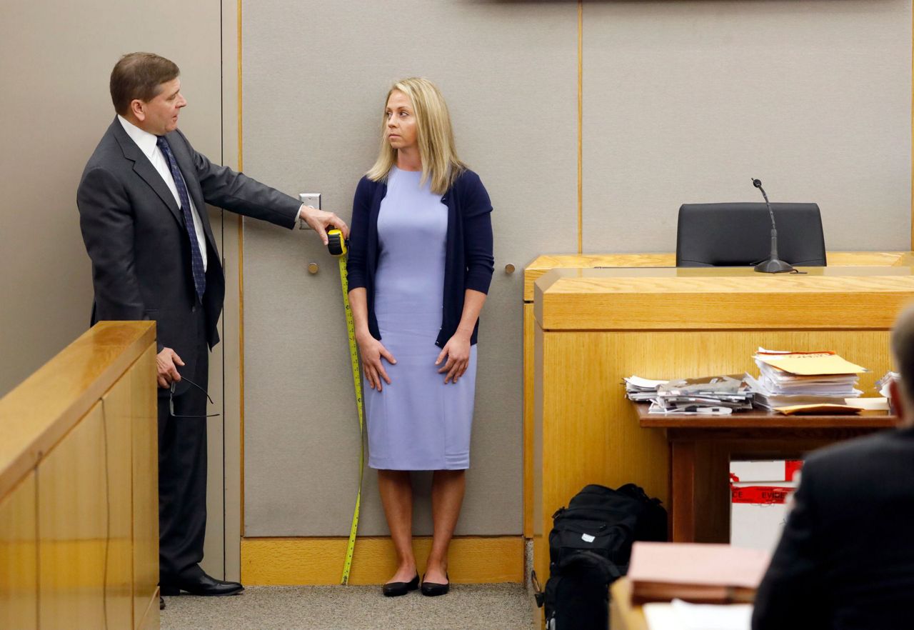 Dallas cop testifies at her murder trial in neighbor's death