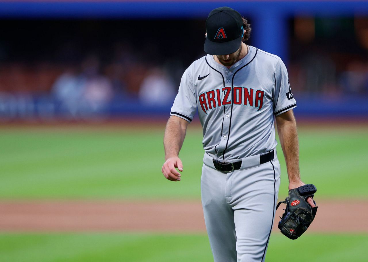 Diamondbacks ace Zac Gallen leaves start vs. Mets after 6 pitches due ...