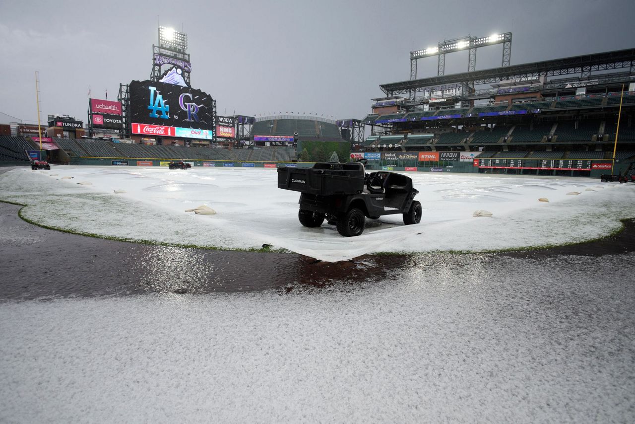 All Hail the Rockies! Pea-sized hail makes Coors Field a winter ...