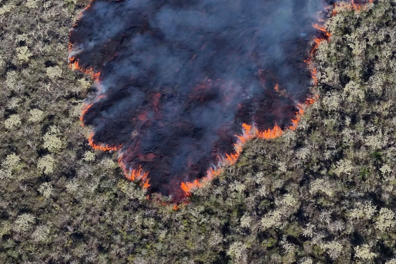 Tallest Galapagos volcano erupts, spewing lava, ash