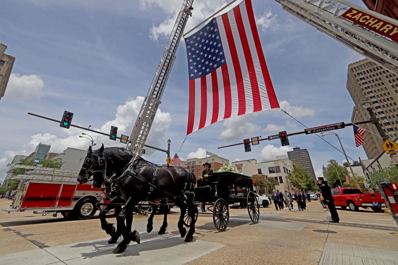 Final parade: Ex-Gov. Edwards carried to funeral site