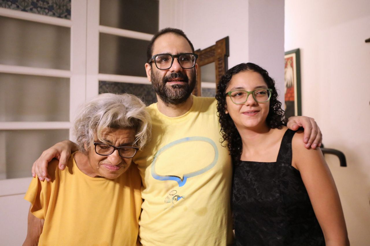 Family reunites as activist Alaa Abd el-Fattah returns home after 12 ...