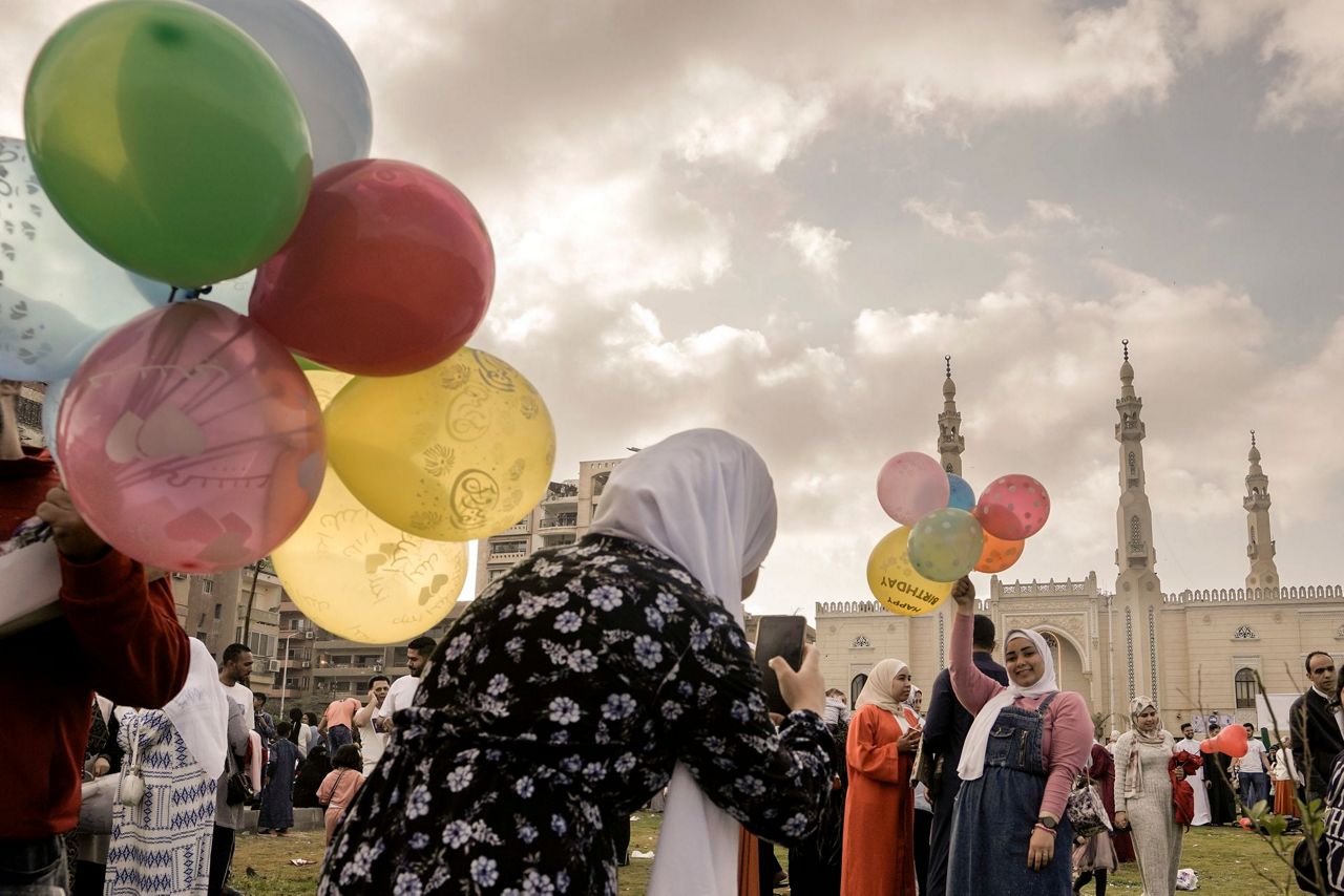 Amid joy and tragedy, Muslims celebrate Eid al-Fitr holiday