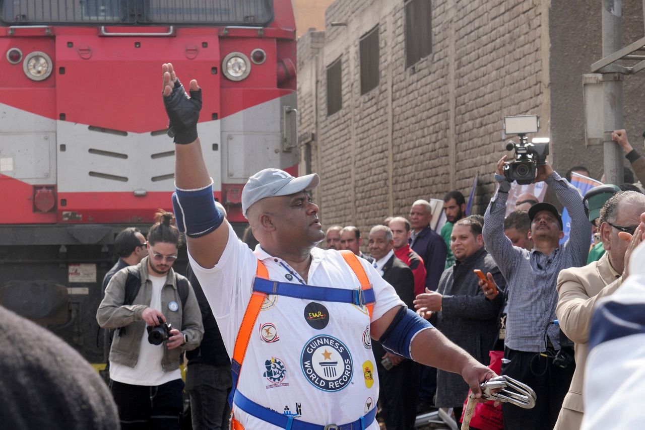 He can pull a train by the strength of his teeth. An Egyptian wrestler ...