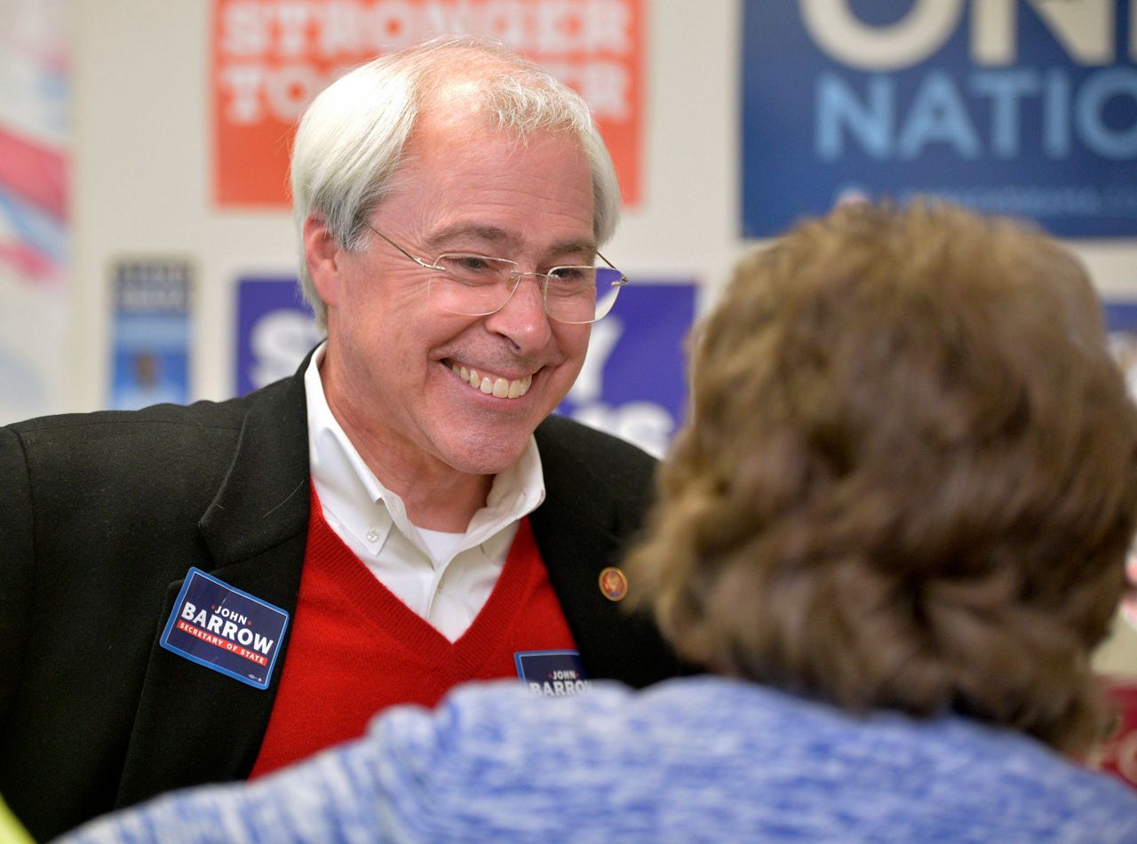The Latest: Republican wins Georgia elections chief runoff