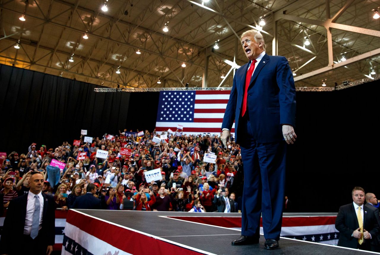 The Latest: Trump urges supporters to vote, knocks media