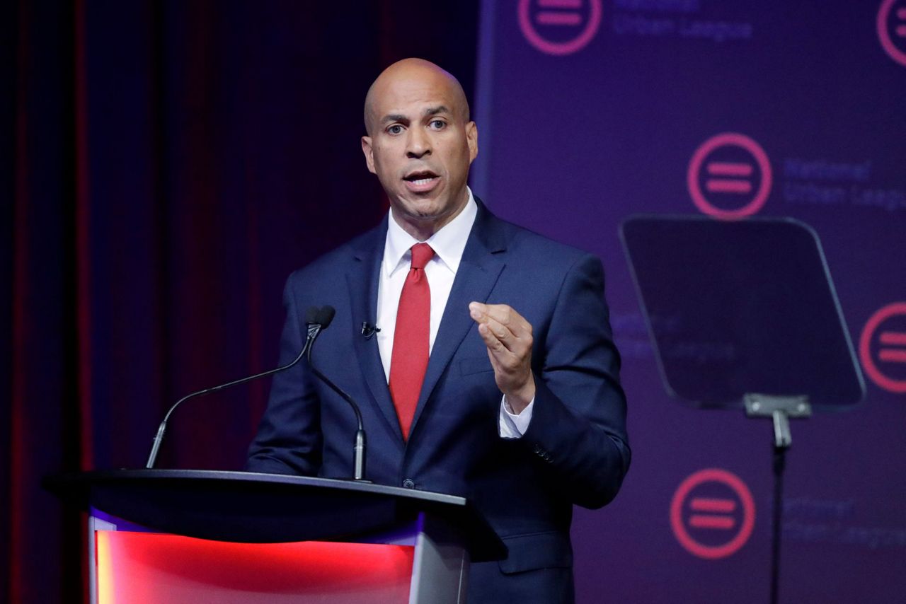 Booker takes on Biden in bid to break through crowded field