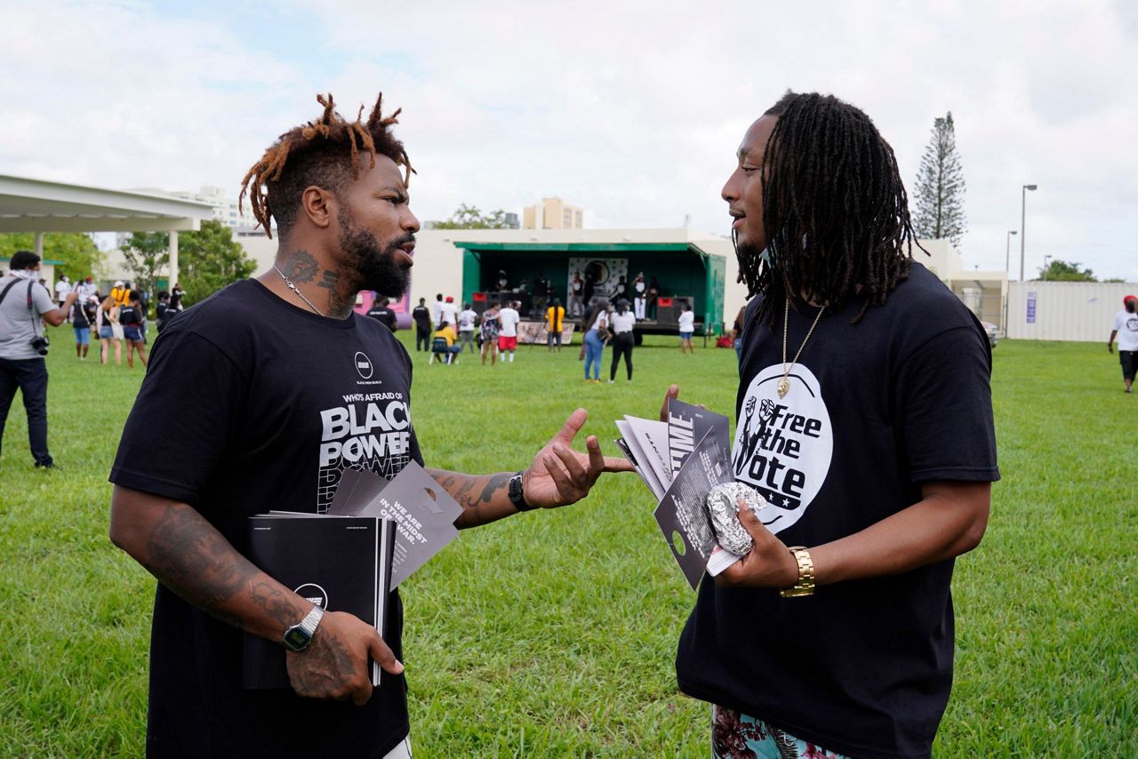 Black men's votes courted, as some search for political home