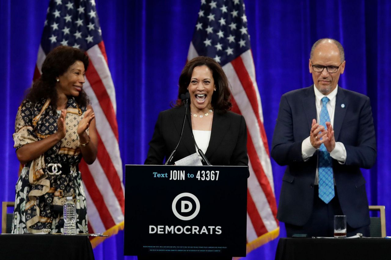 The Latest: Bennet slams debate rules at Democratic meeting