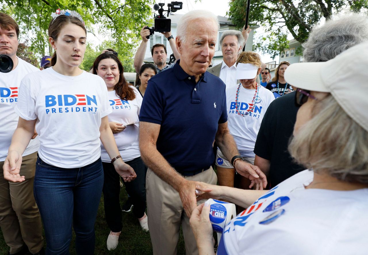 The Latest: Biden, O'Rourke talk baseball at Iowa ballpark