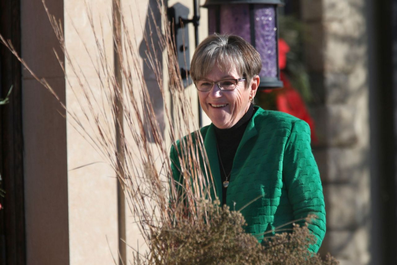 Kansas governor's break with Biden is latest appeal to GOP