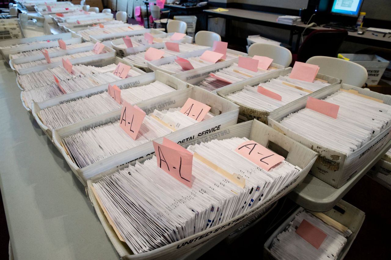 Mail ballot fight persists in key states, sure to slow count