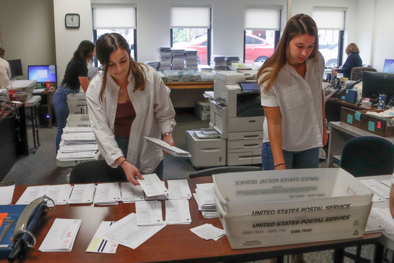 Mail ballot fight persists in key states, sure to slow count