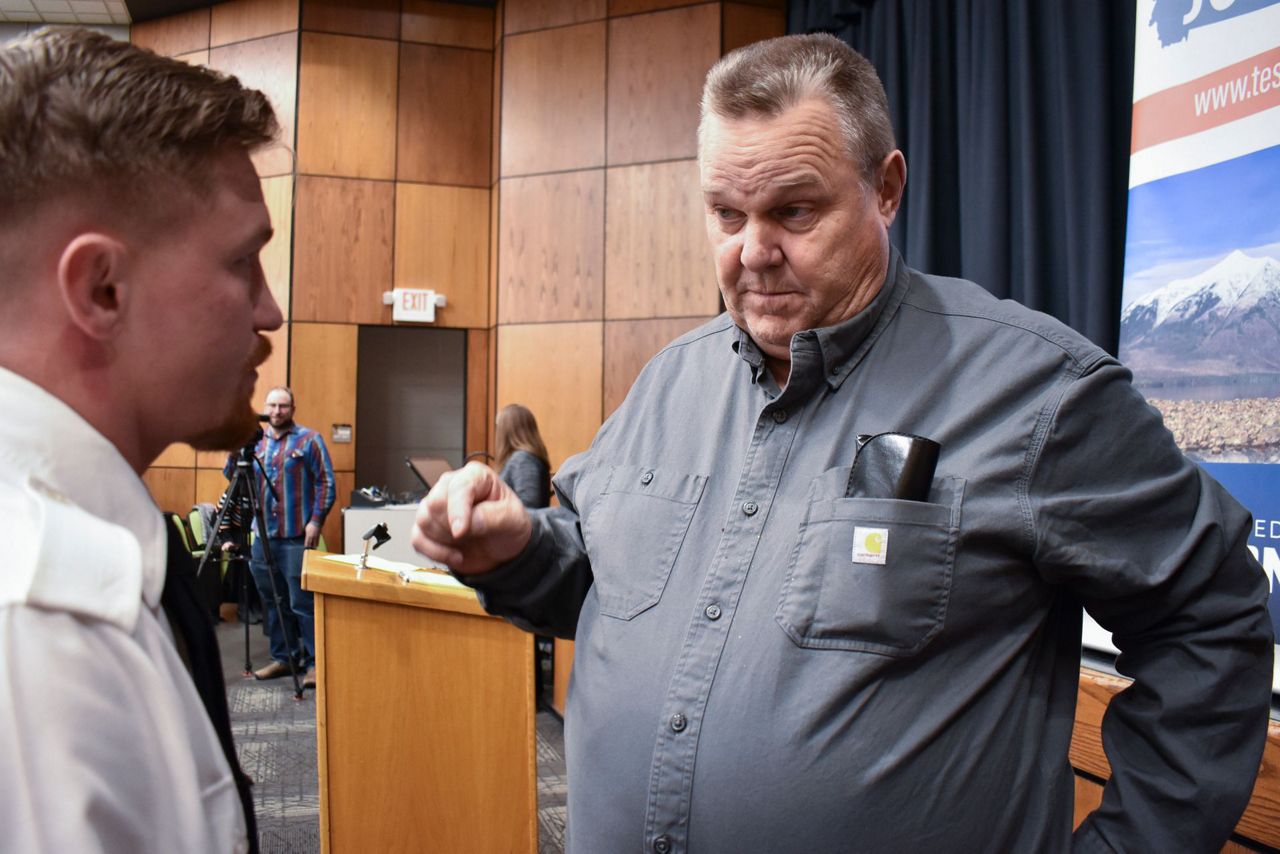 A Montana farmer with a flattop and ample lobbyist cash stands between ...
