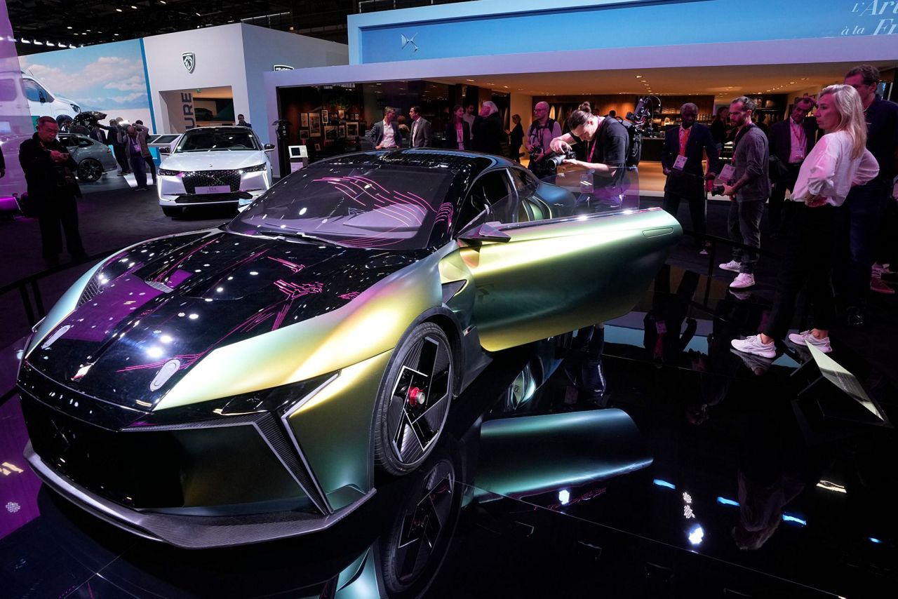 Electric vehicles take center stage at pared-back Paris show