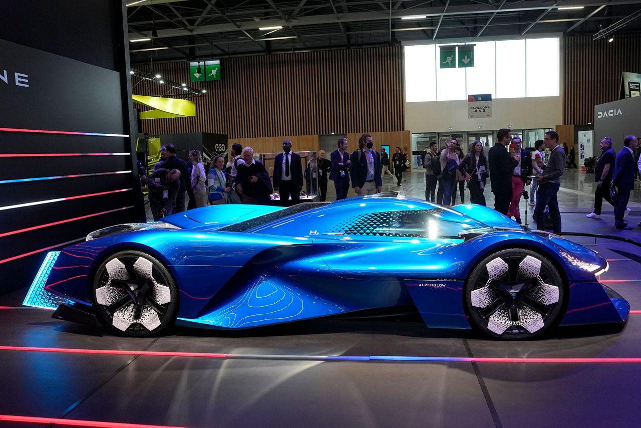 Electric vehicles take center stage at pared-back Paris show