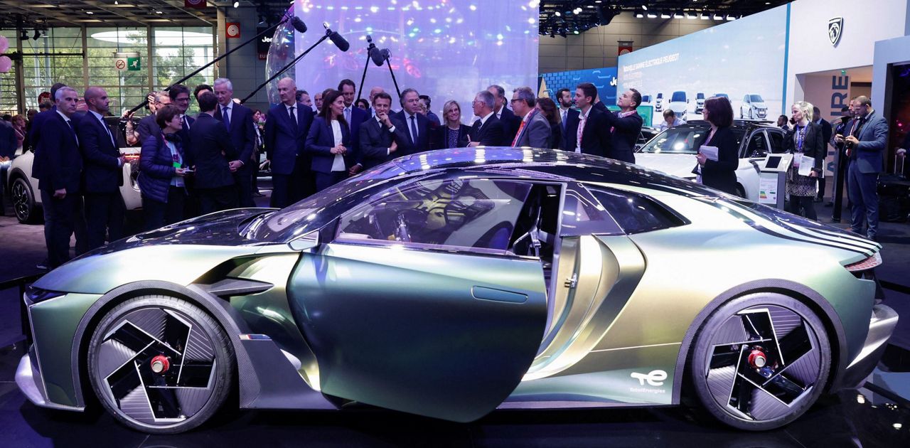 Electric vehicles take center stage at pared-back Paris show
