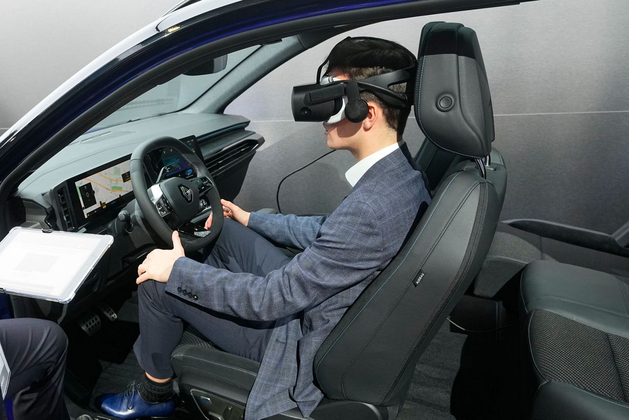 Electric vehicles take center stage at pared-back Paris show