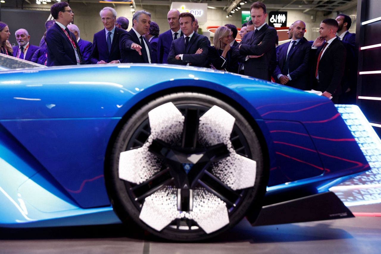 Electric vehicles take center stage at pared-back Paris show