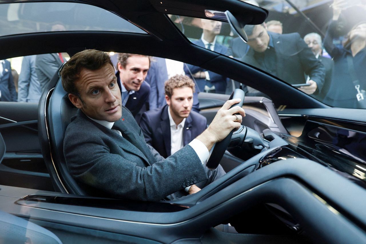 Electric vehicles take center stage at pared-back Paris show