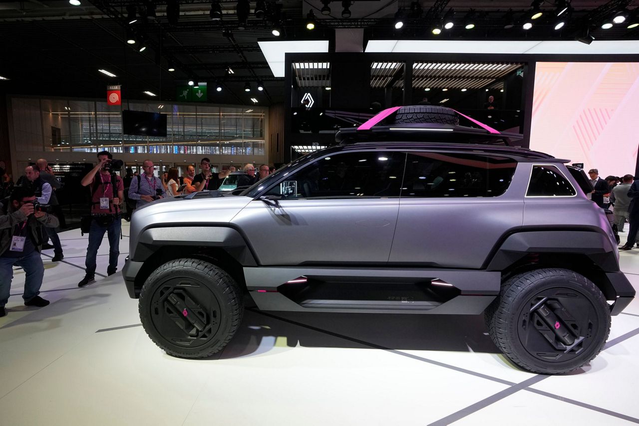 Electric vehicles take center stage at pared-back Paris show