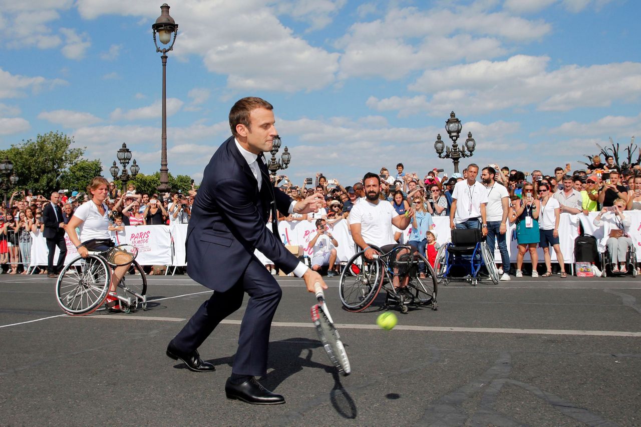 France's president pounds a punching bag on camera, and Europe notices