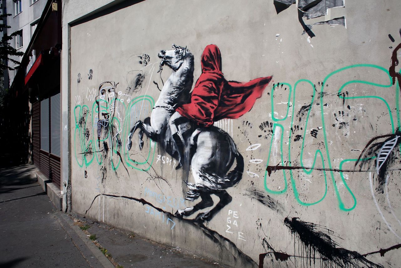 Street artist Banksy splashes Paris with works on migrants