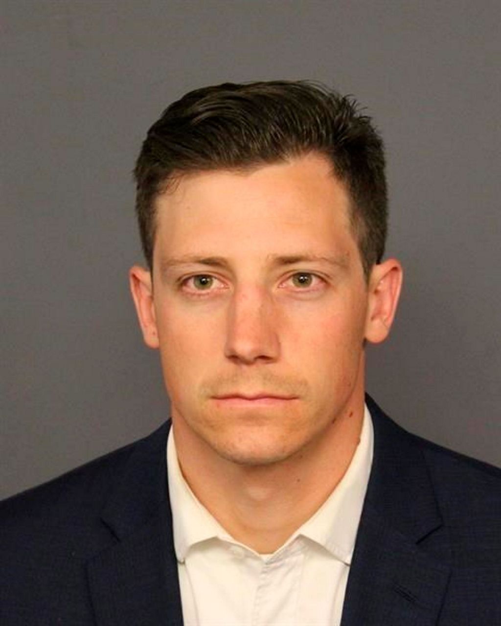 FBI agent who dropped gun while dancing charged with assault