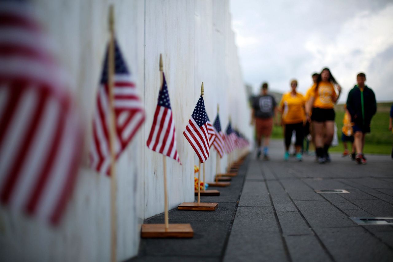 The Latest: Tower memorial dedicated at Flight 93 crash site