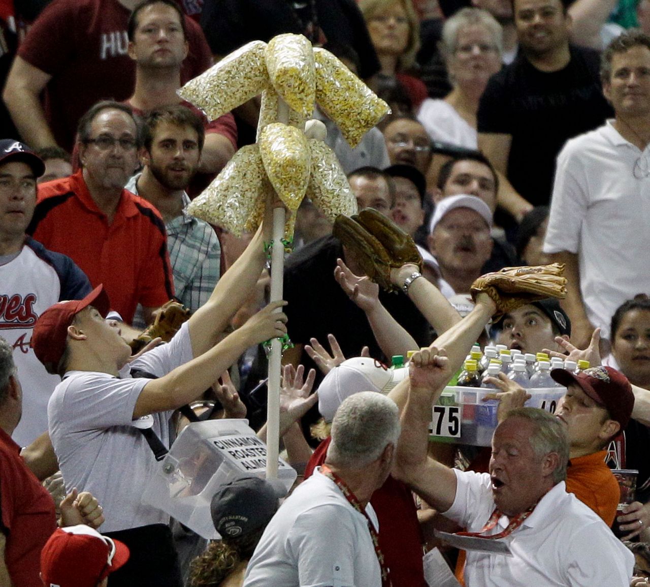What a play! Fan grabs foul ball in cup, chugs the beer