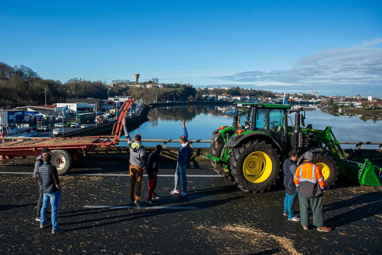 Farmers block roads across France to protest low wages and countless ...